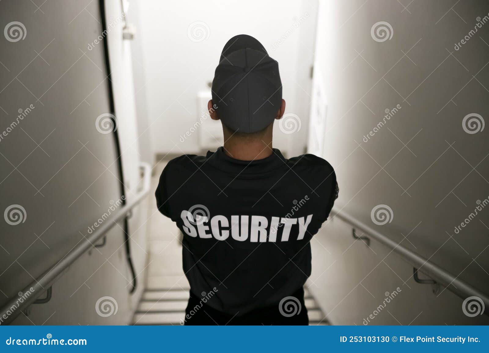 Security Guard Patrolling on Stairs Inside Commercial Building Stock ...