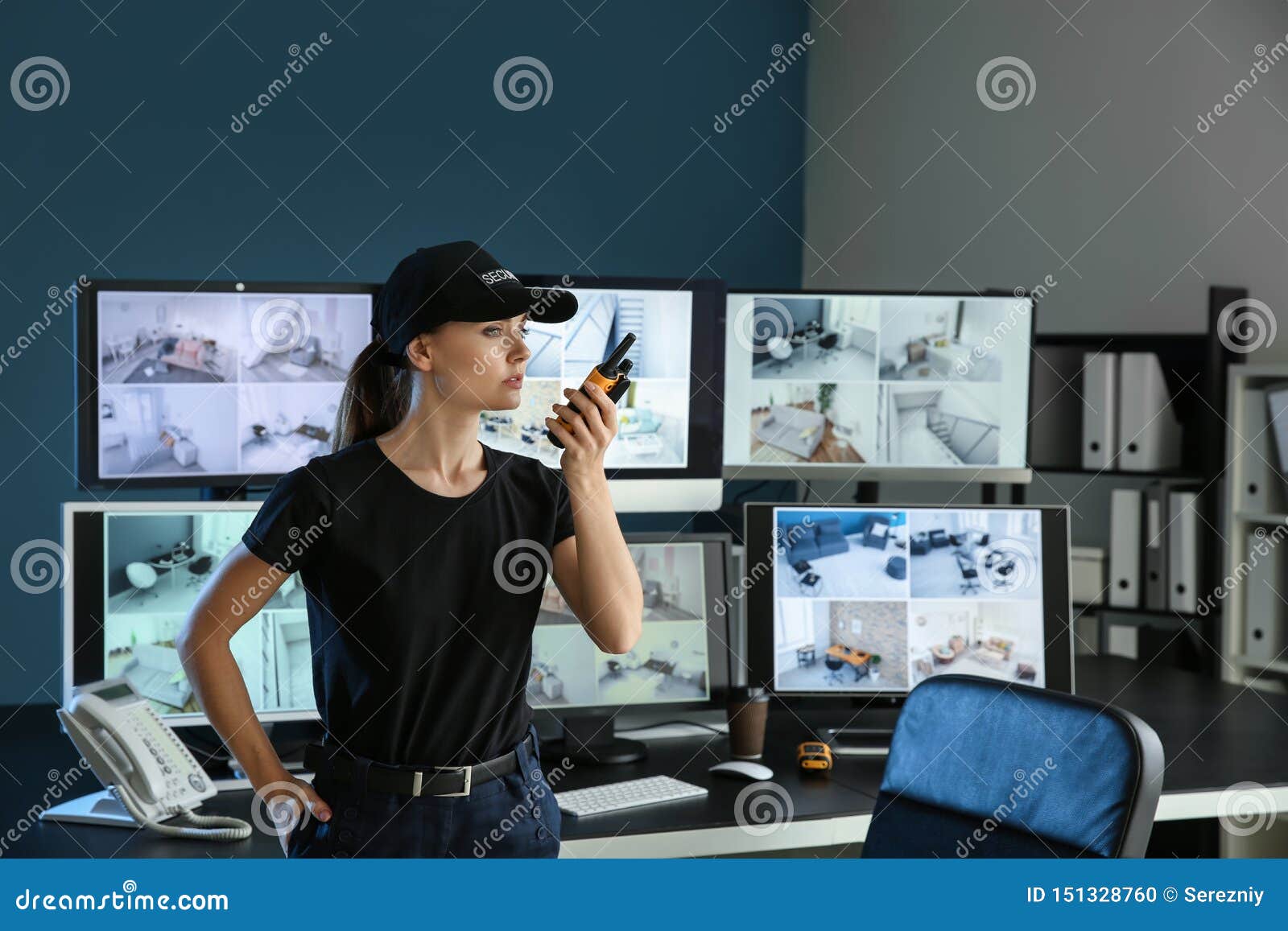 Security Guard with Portable Radio Transmitter in Surveillance Room ...