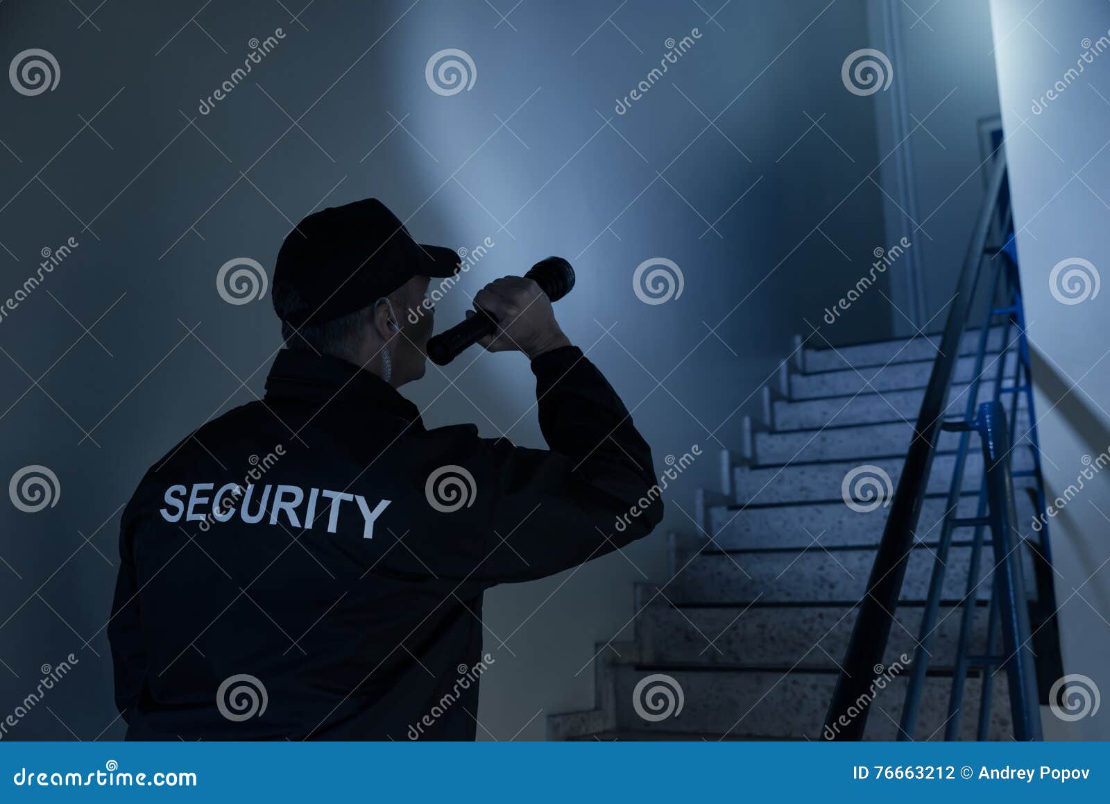 Security Guard Searching On Stairway With Flashlight Stock Photo ...