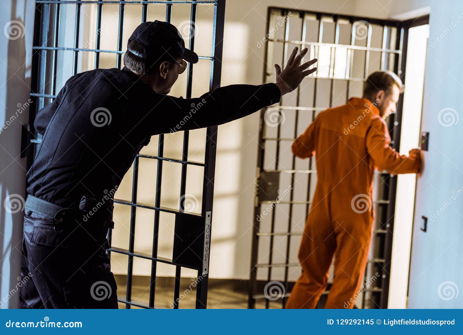Security Guard Showing Stop Sign To Stock Image - Image of prisonbars ...