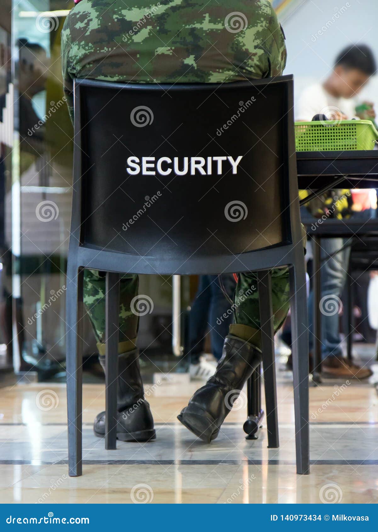 Security Guard Sitting on a Chair Stock Photo - Image of control ...