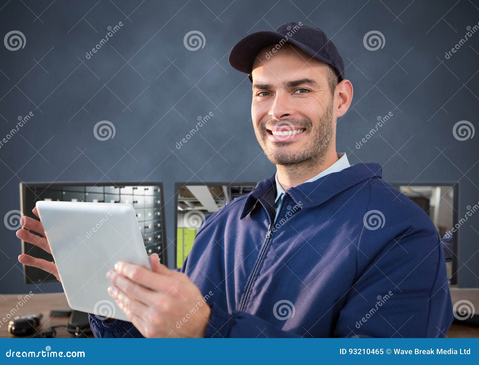 Security Guard Smiling in Front of the Computers with Tablet Stock ...