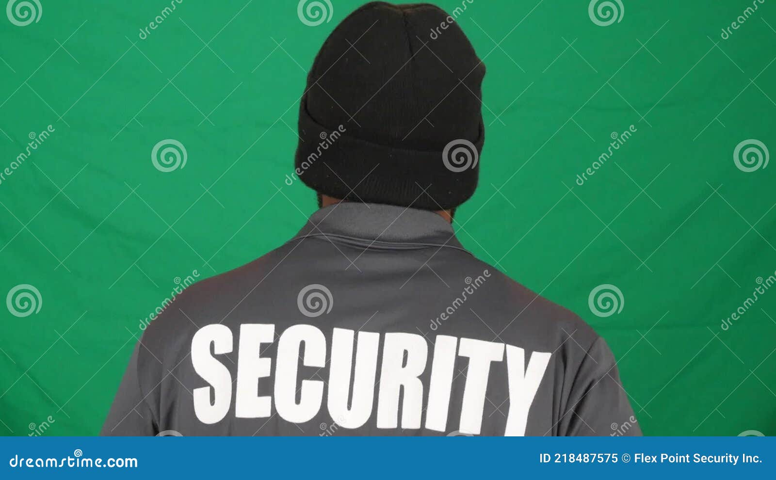 Security Guard Standing on the Green Background. Stock Video - Video of ...