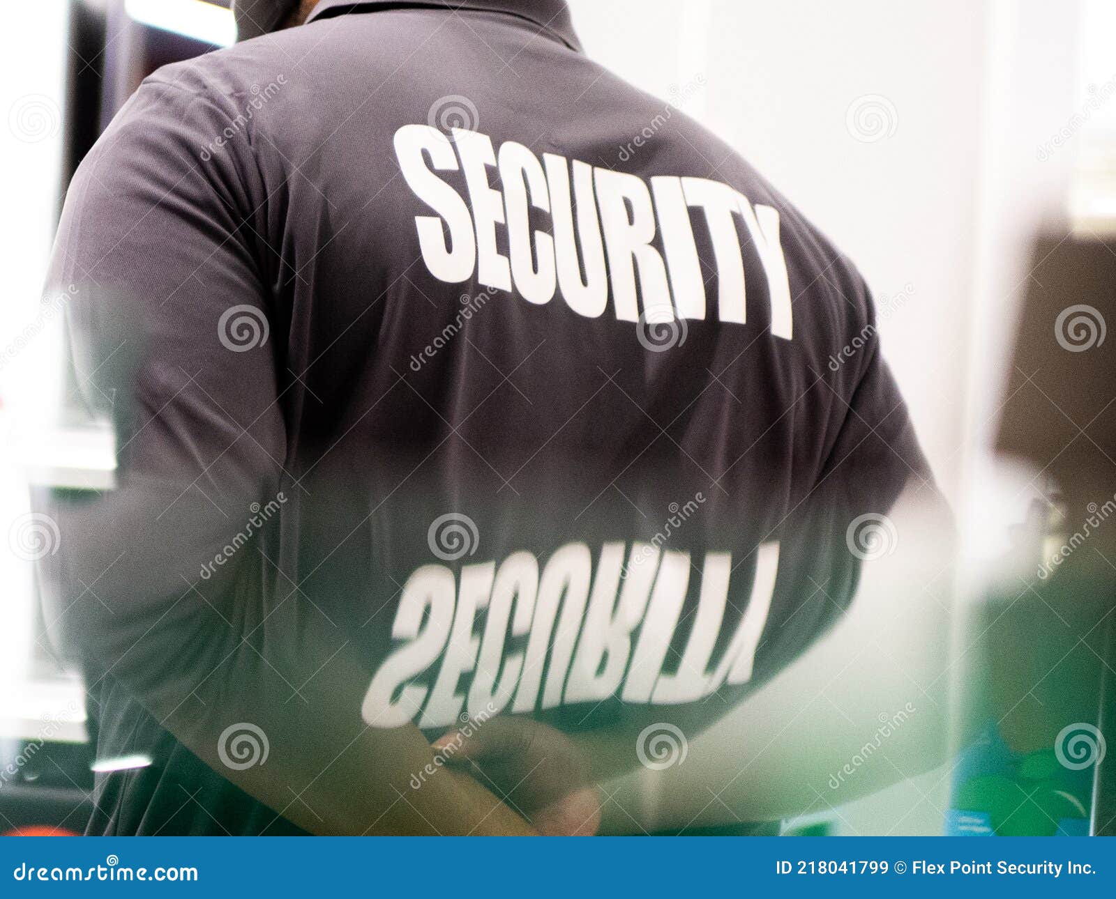 Security Guard Standing Inside Commercial Building Nearby the Window ...