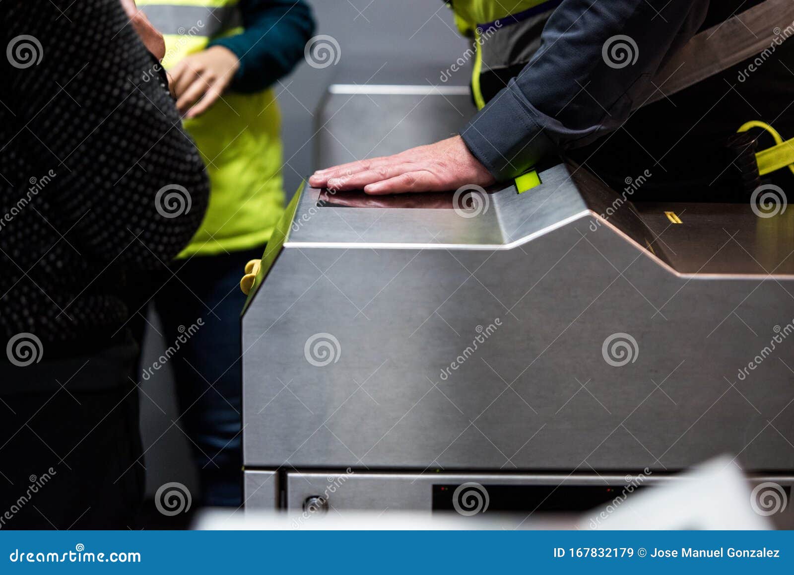 Security Guard in Subway Station. Guard Checking an Automatic Ticket ...