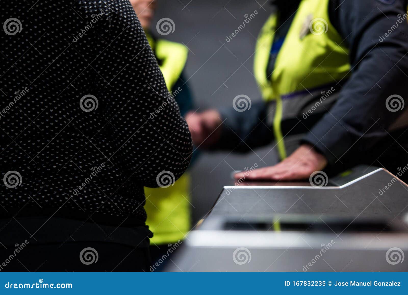 Security Guard in Subway Station. Guard Checking an Automatic Ticket ...