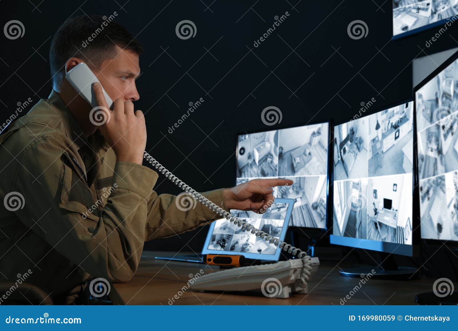 Security Guard Talking on Telephone Stock Image - Image of laptop ...