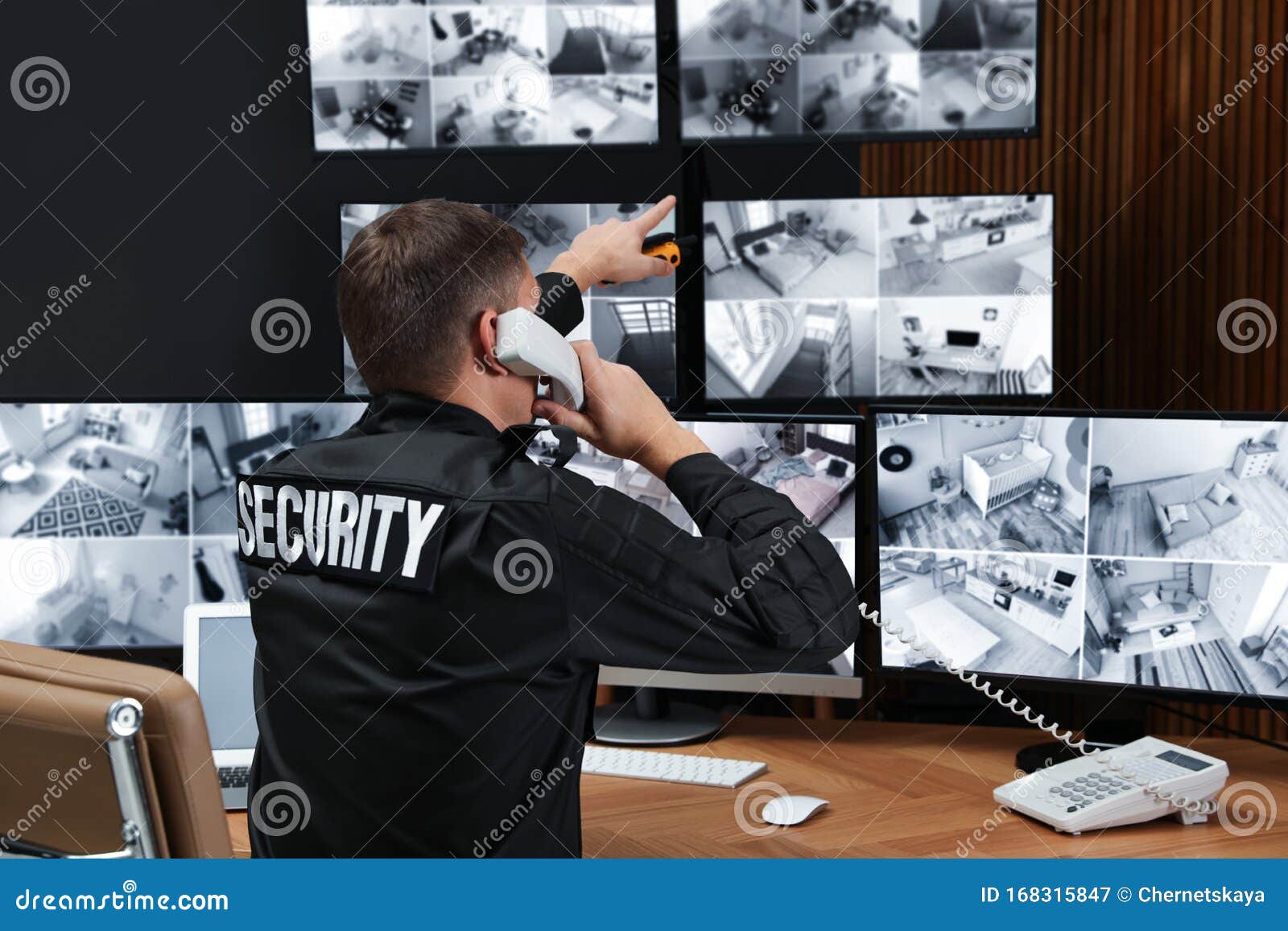 Security Guard Talking on Telephone at Workplace Stock Image - Image of ...