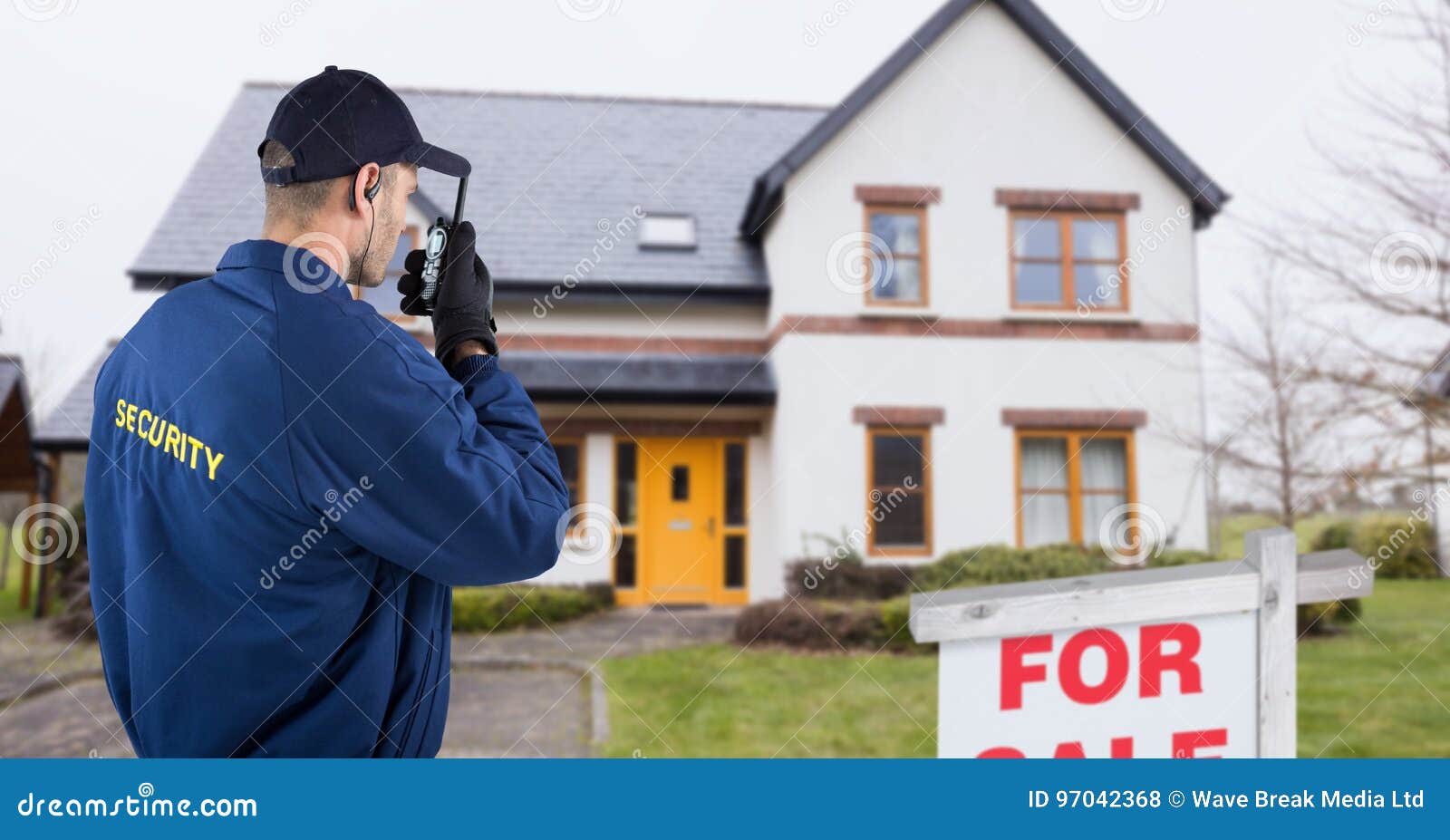 Security Guard Talking on Walkie Talkie while Standing on Road Stock ...