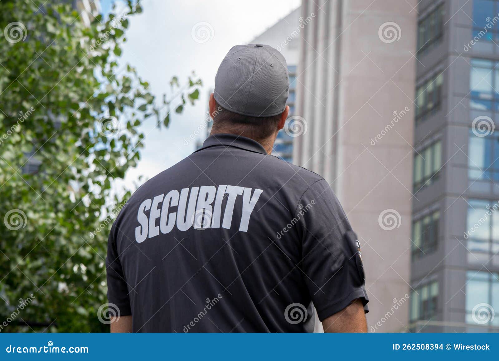 Security Guard in Uniform Patrolling a Residential Area. Stock Photo ...