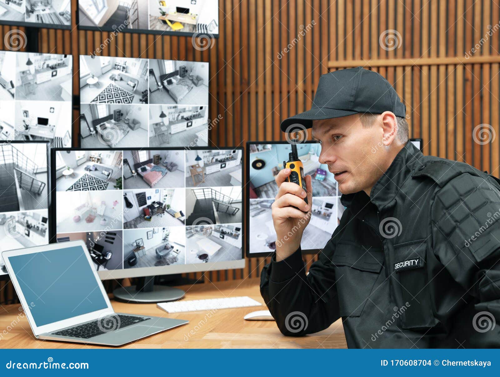 Security Guard Using Portable Transmitter at Workplace Stock Photo ...