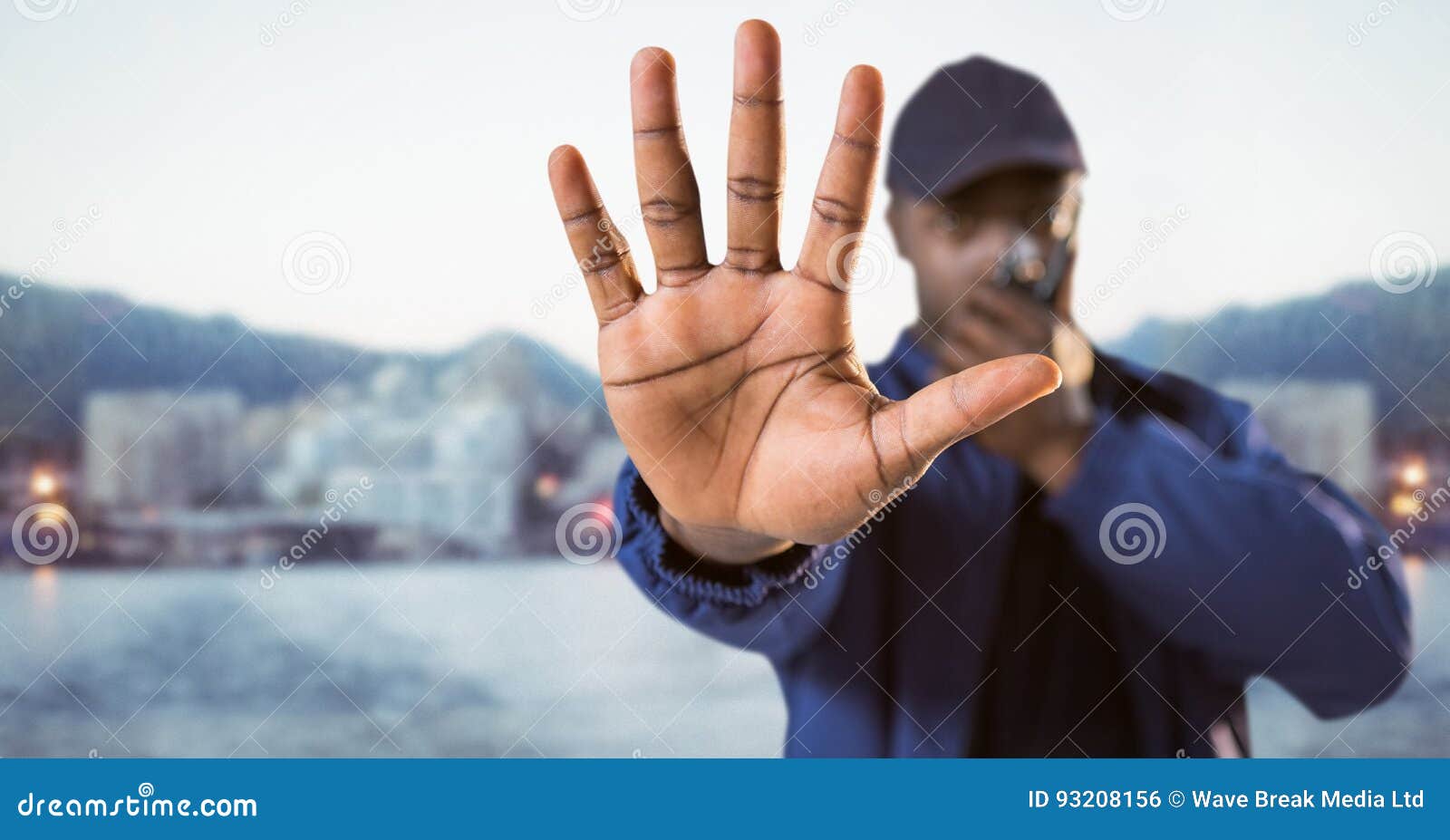 Security Guard with Walkie Talkie and Hand in Front Against Blurry ...
