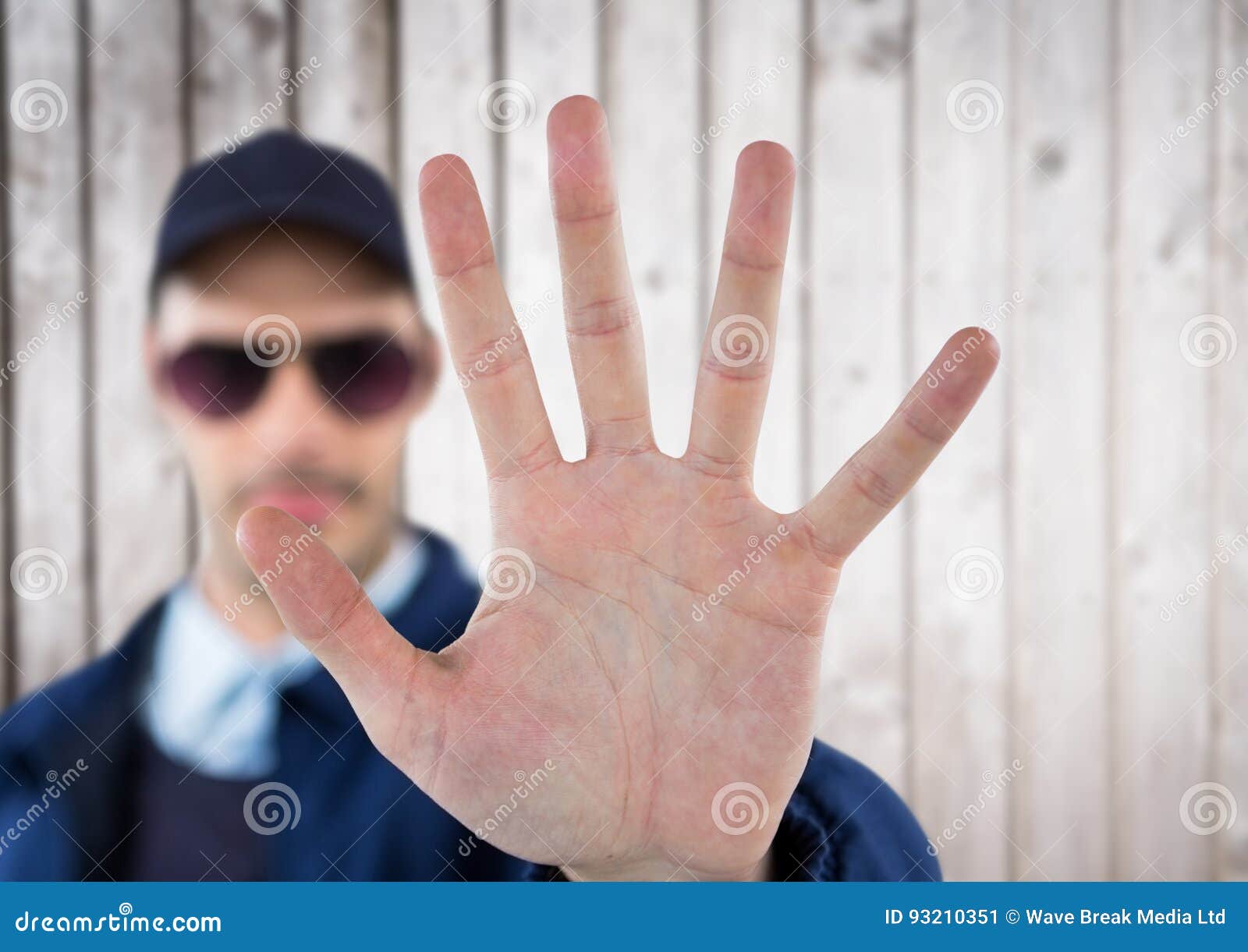 Security Guard Whit His Hand Up Saying Stop. White Wood Stock Image ...