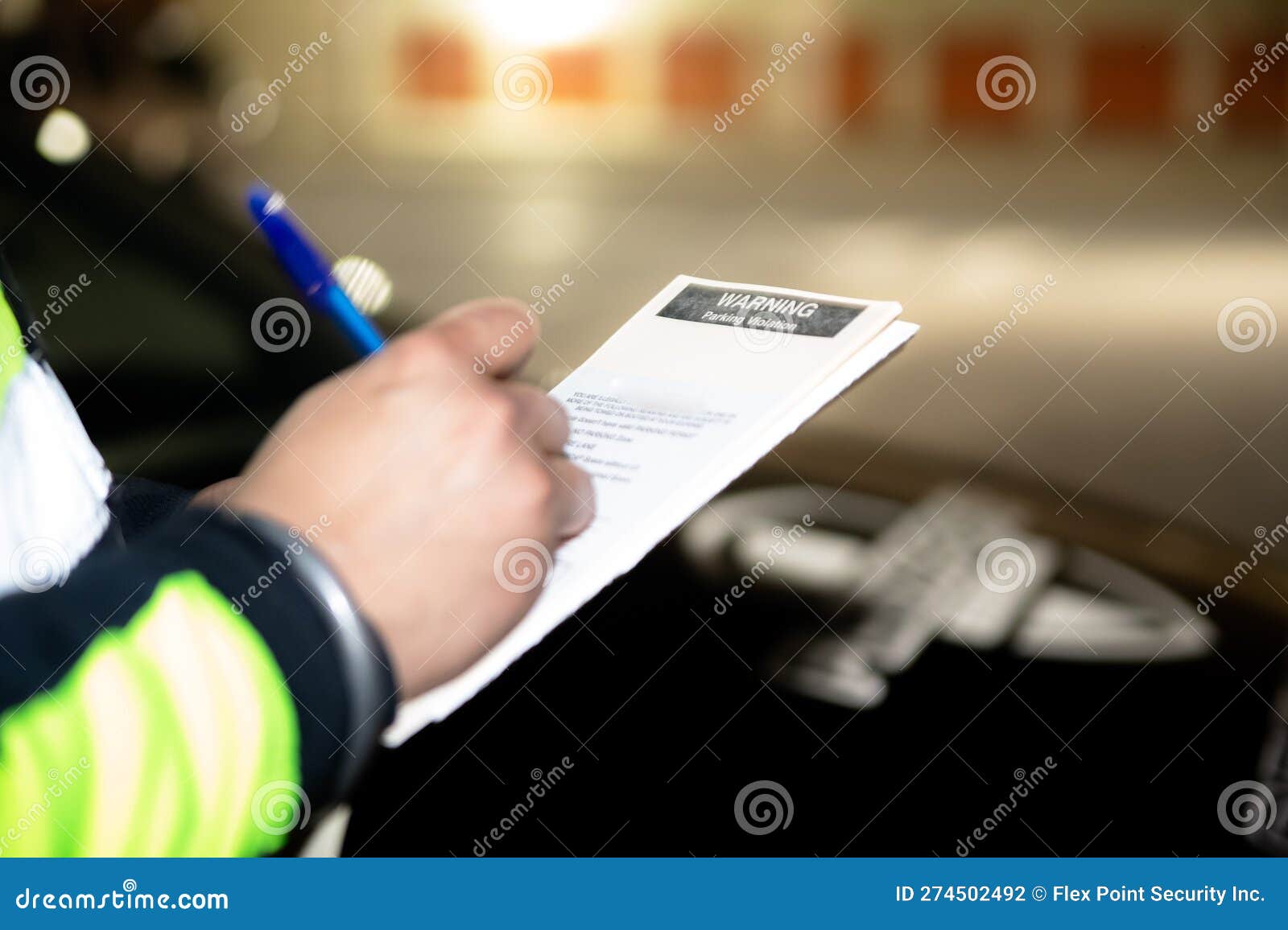 A Security Guard is Giving a Parking Ticket To Illegal Parking on ...