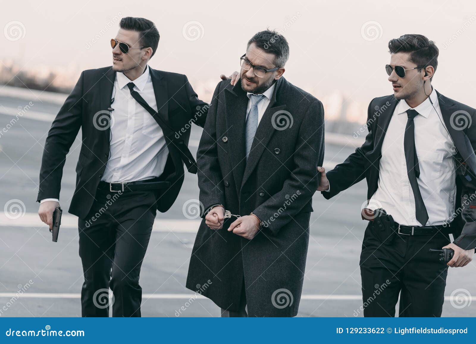 Security Guards with Guns Going with Arrested Man Stock Photo - Image ...