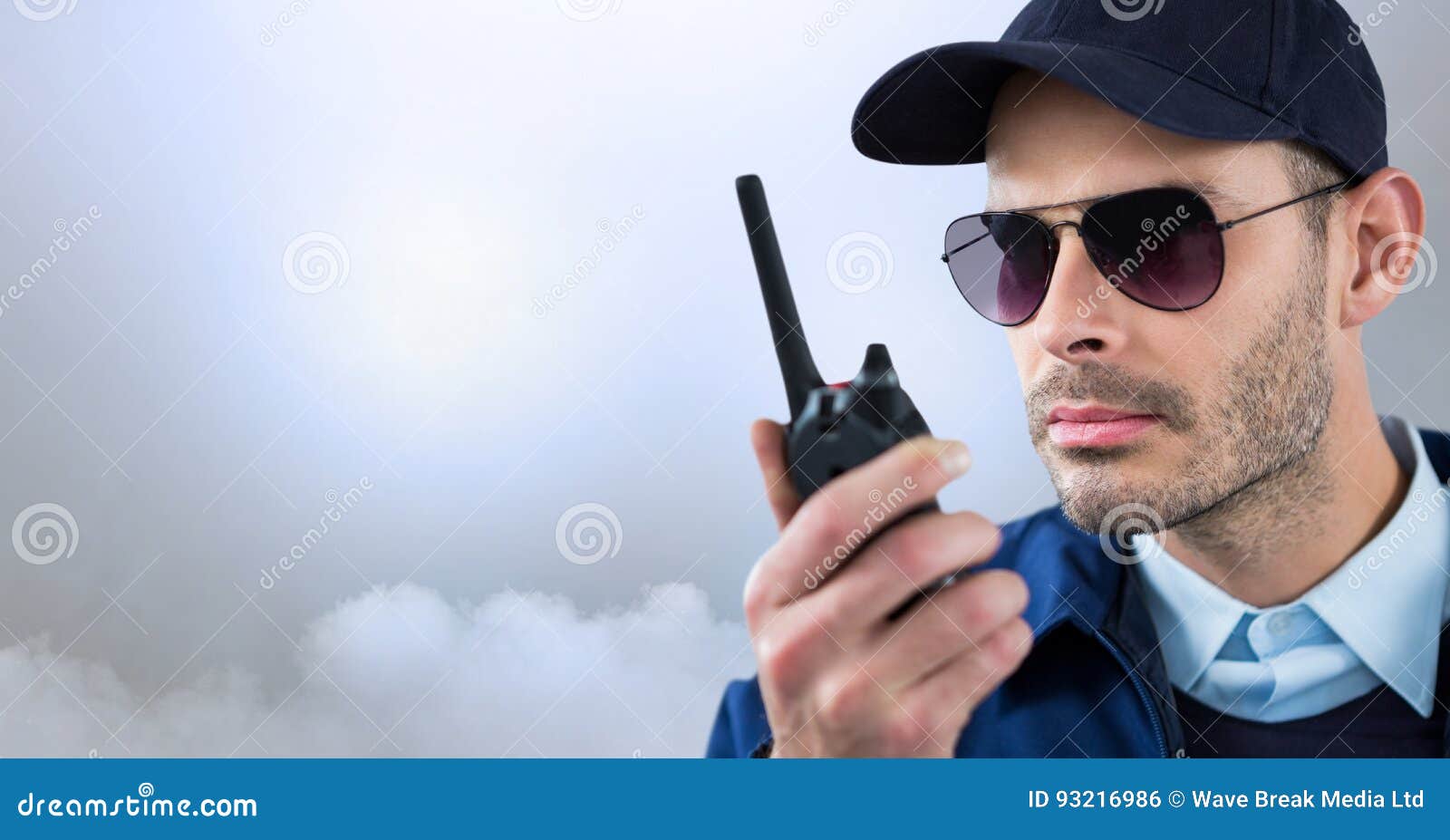 Security Man Outside with Bright Background Clouds Stock Photo - Image ...