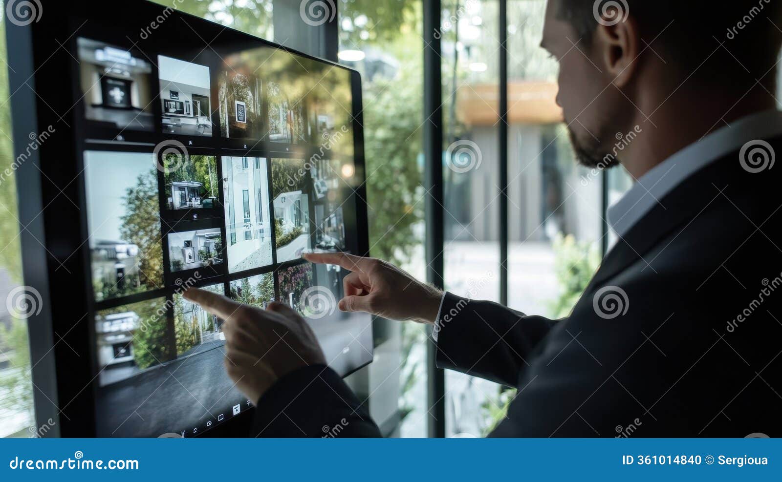 A Security Officer Engaged with a Touchscreen Display, Overseeing ...