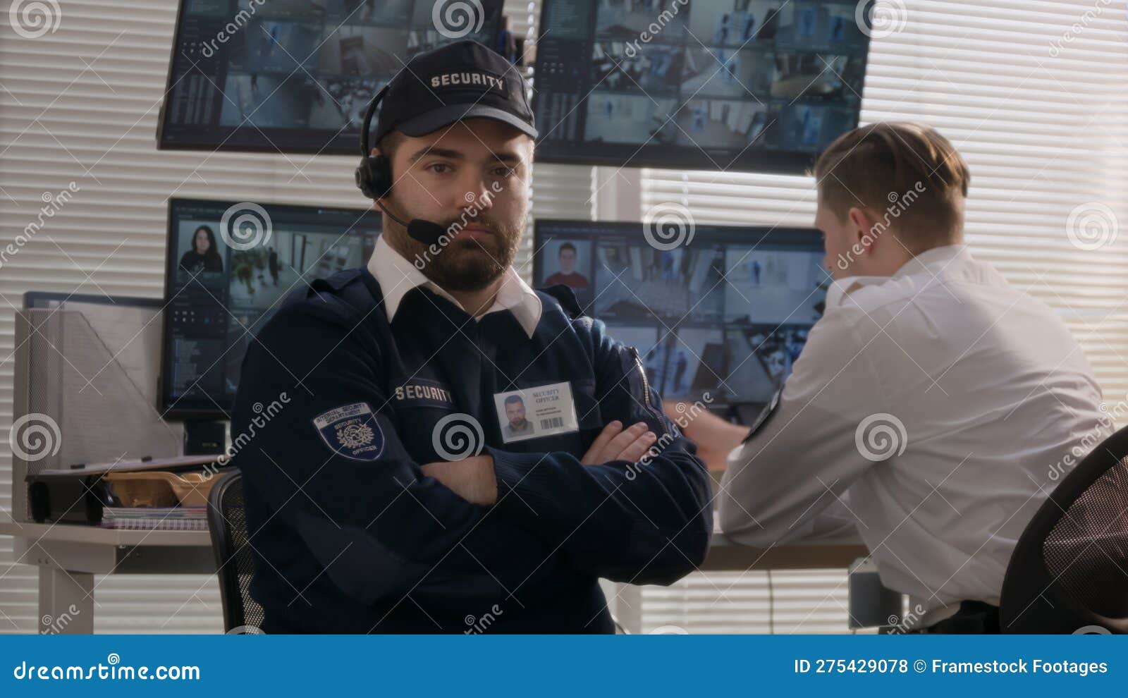 Security Officer in Headset Looks at Camera Stock Photo - Image of ...