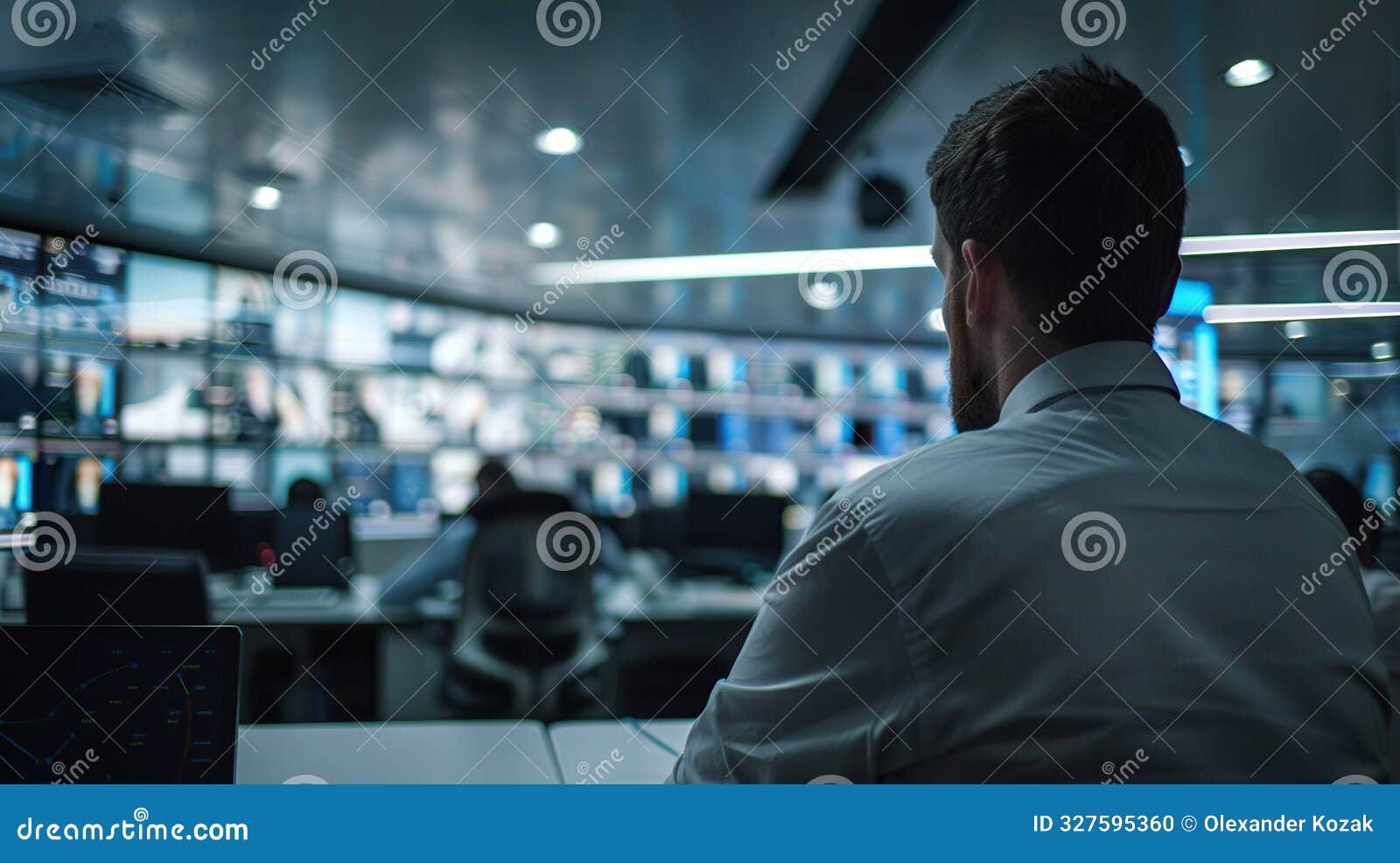 A Security Officer Monitoring Multiple CCTV Feeds in a Control Room ...