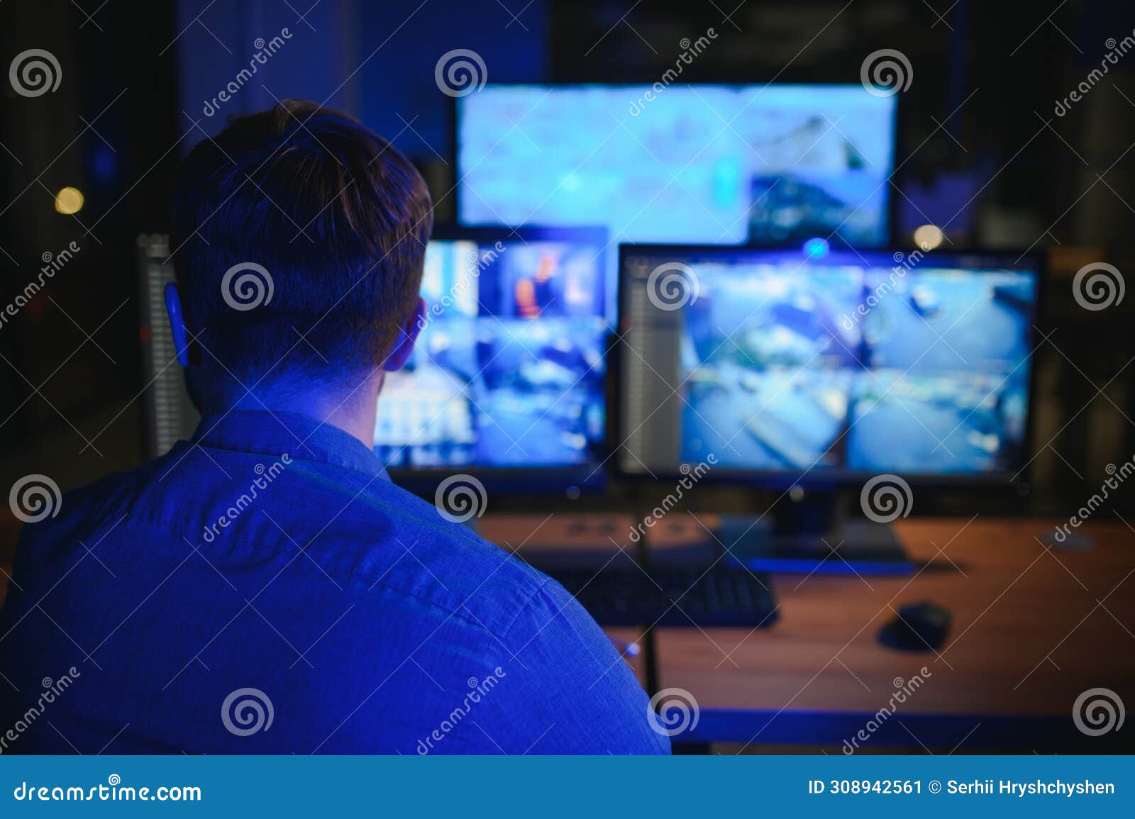 Security Operator Controls CCTV Cameras in Office at Night. Modern ...