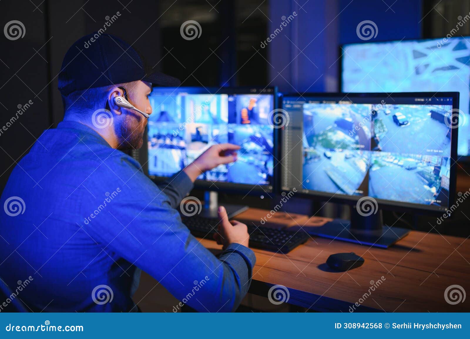 Security Operator Controls CCTV Cameras in Office at Night. Modern ...