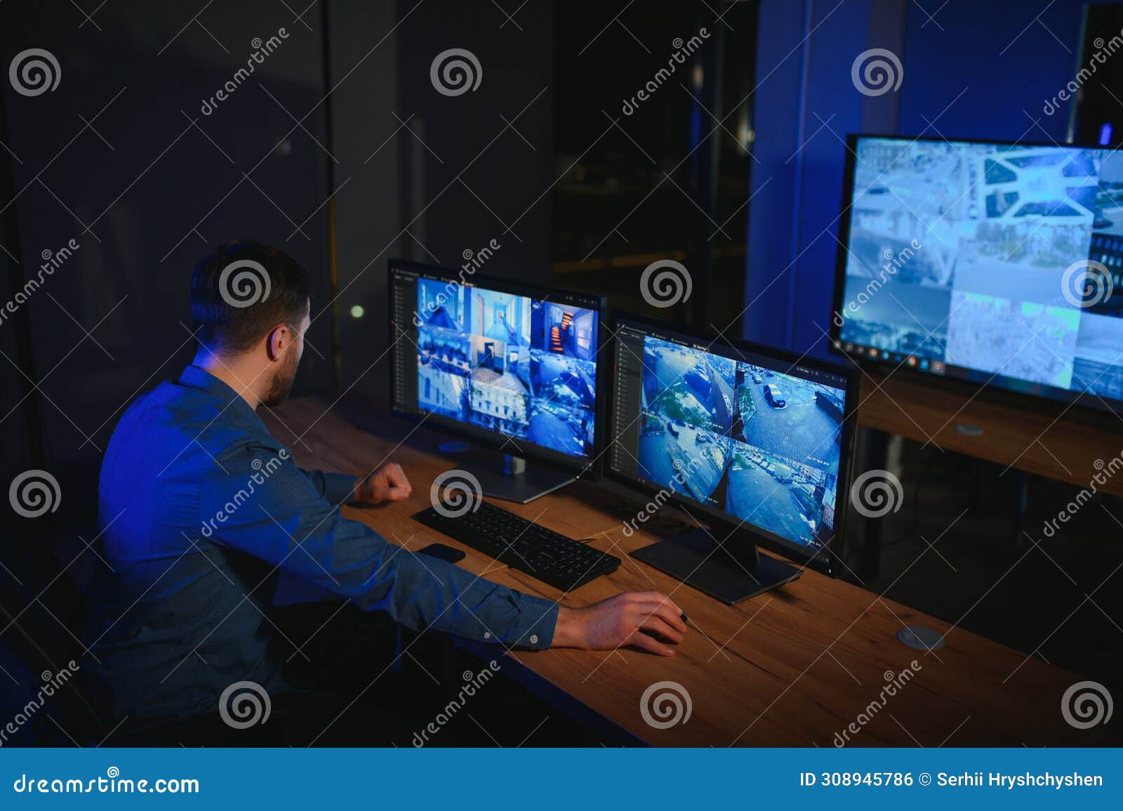 Security Operator Controls CCTV Cameras in Office at Night. Modern ...