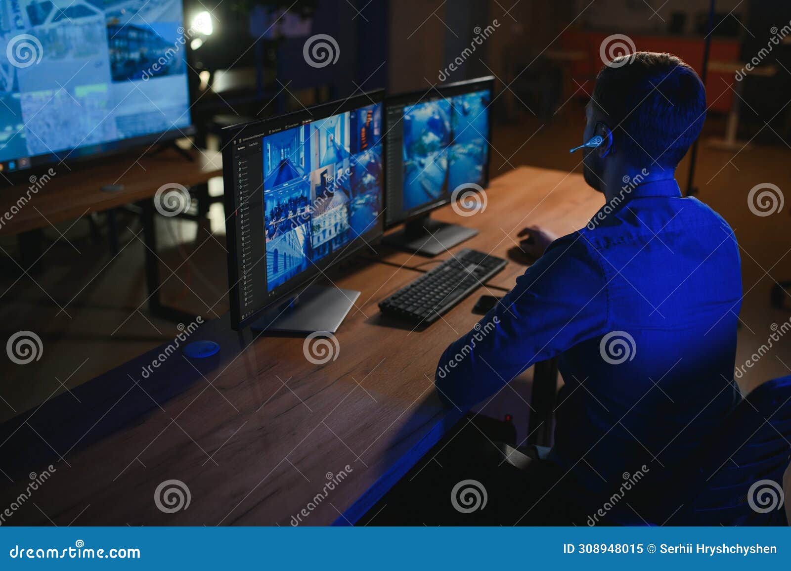 Security Operator Controls CCTV Cameras in Office at Night. Modern ...