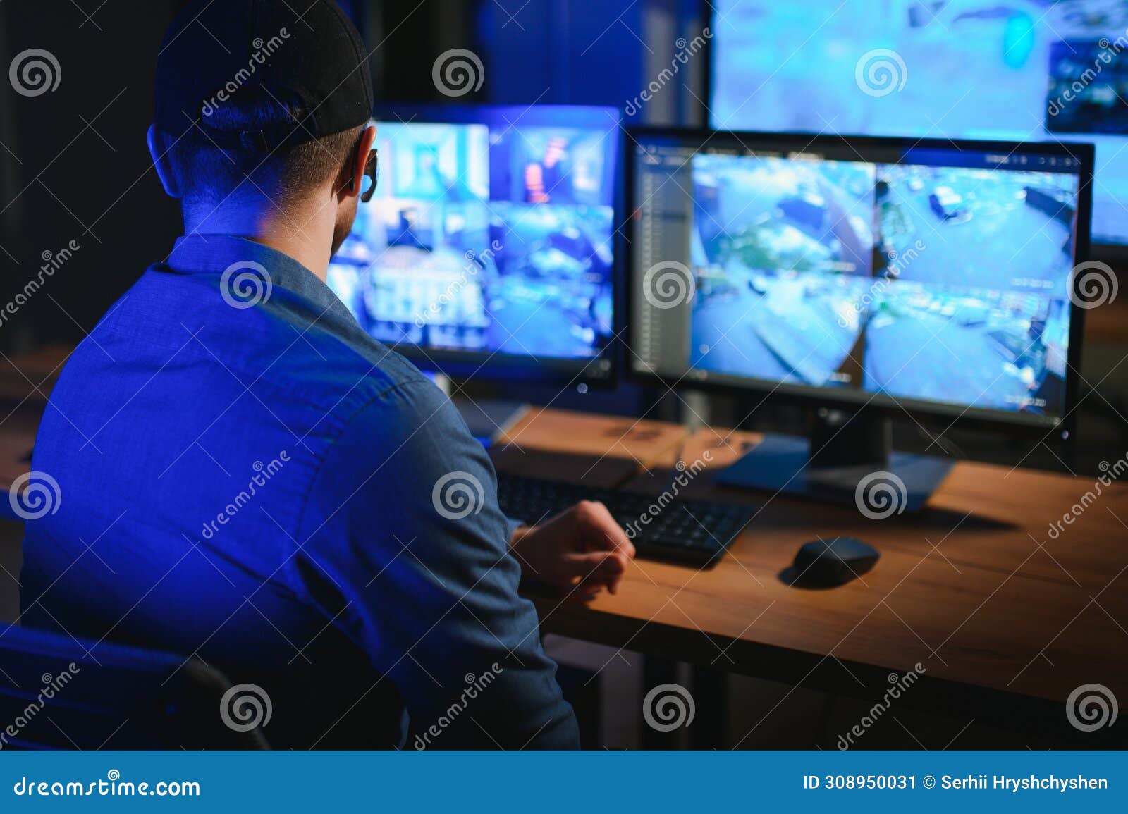 Security Operator Controls CCTV Cameras in Office at Night. Modern ...