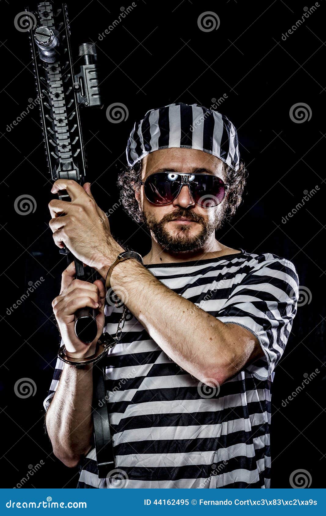 Torture .Prison Riot Concept. Man Holding A Machine Gun, Prisoner ...