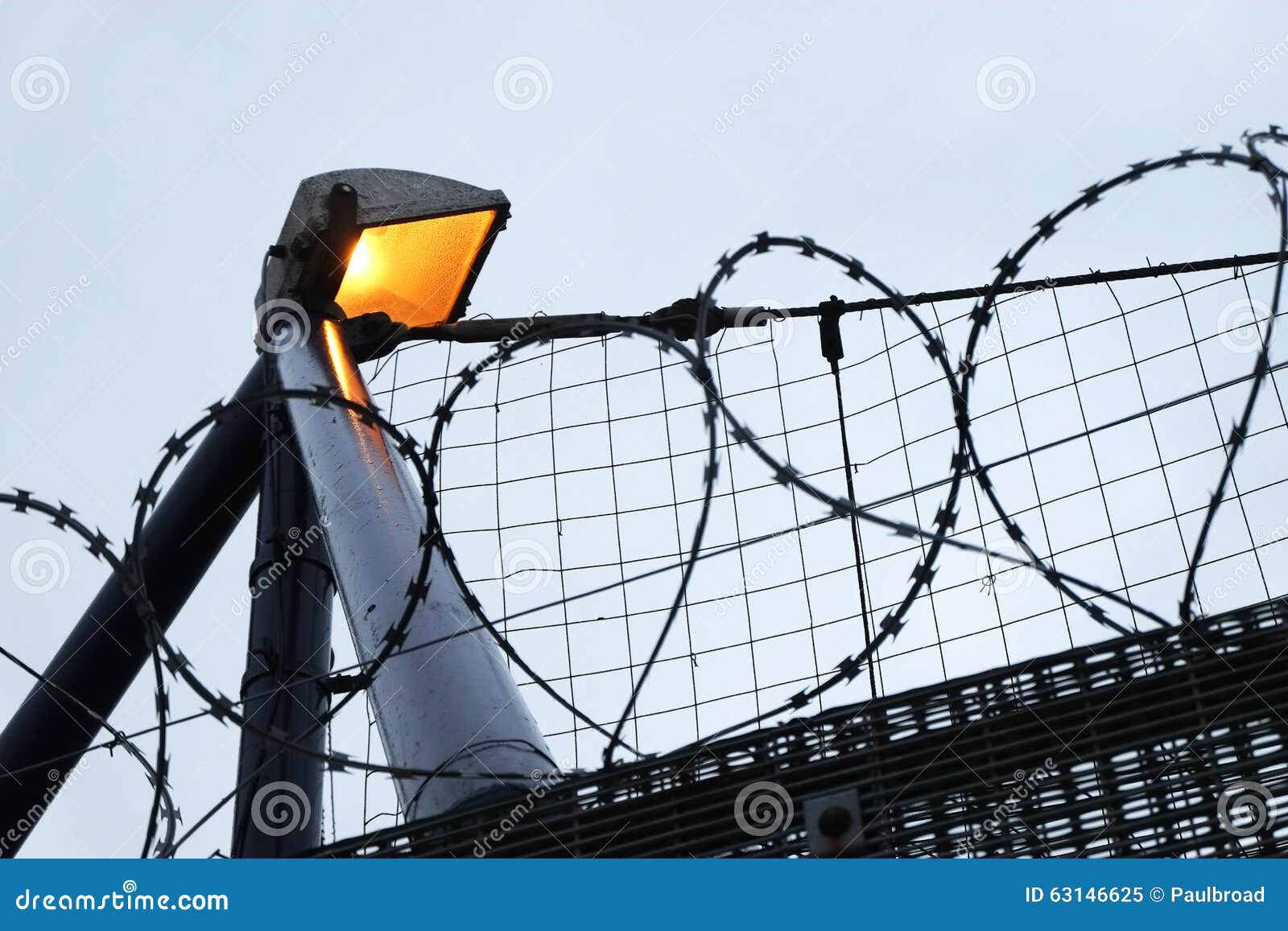 Security Razor Wire Fence and Lighting. Stock Image - Image of fence ...
