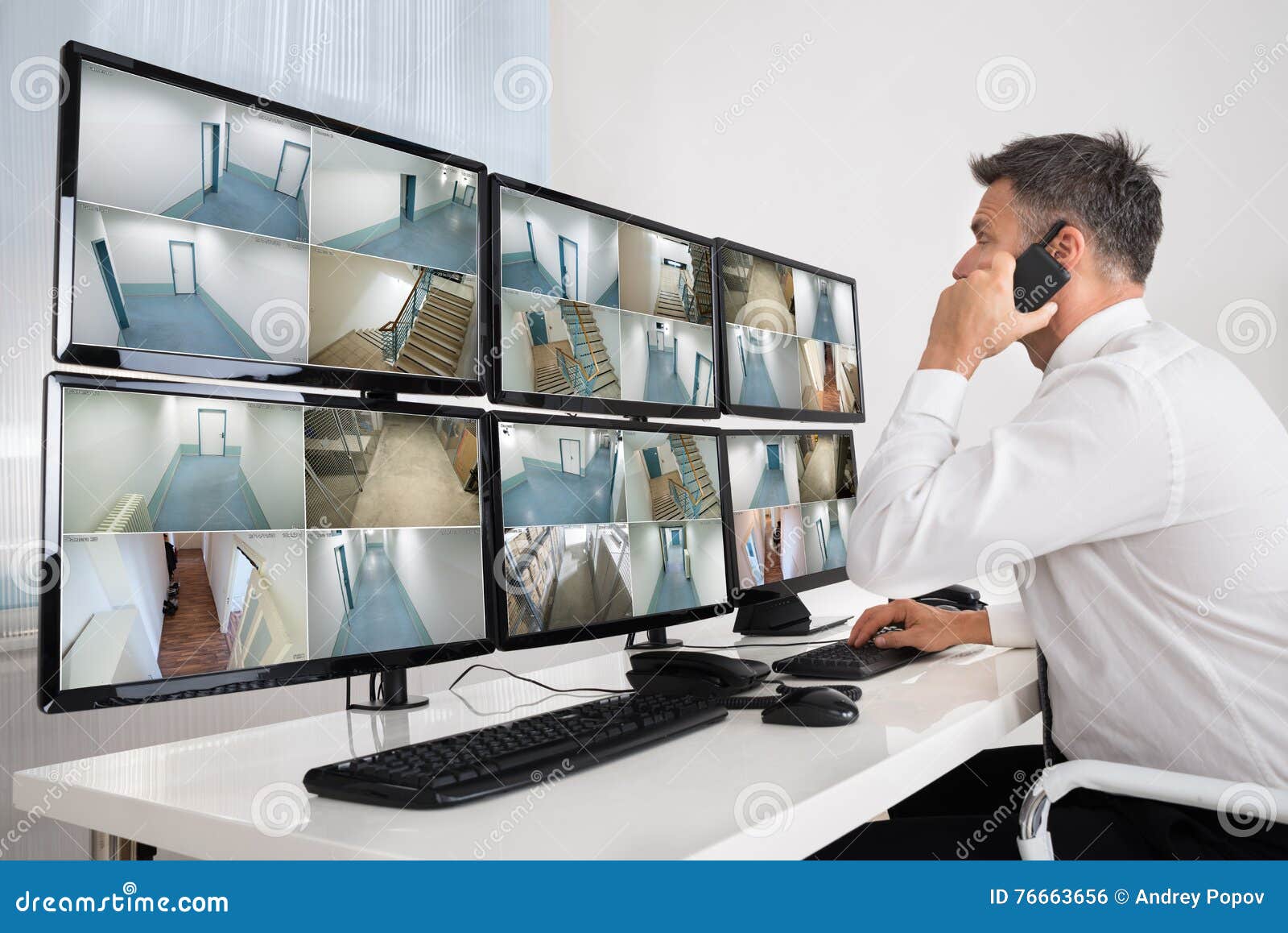 Security System Operator Looking at CCTV Footage Stock Photo - Image of ...