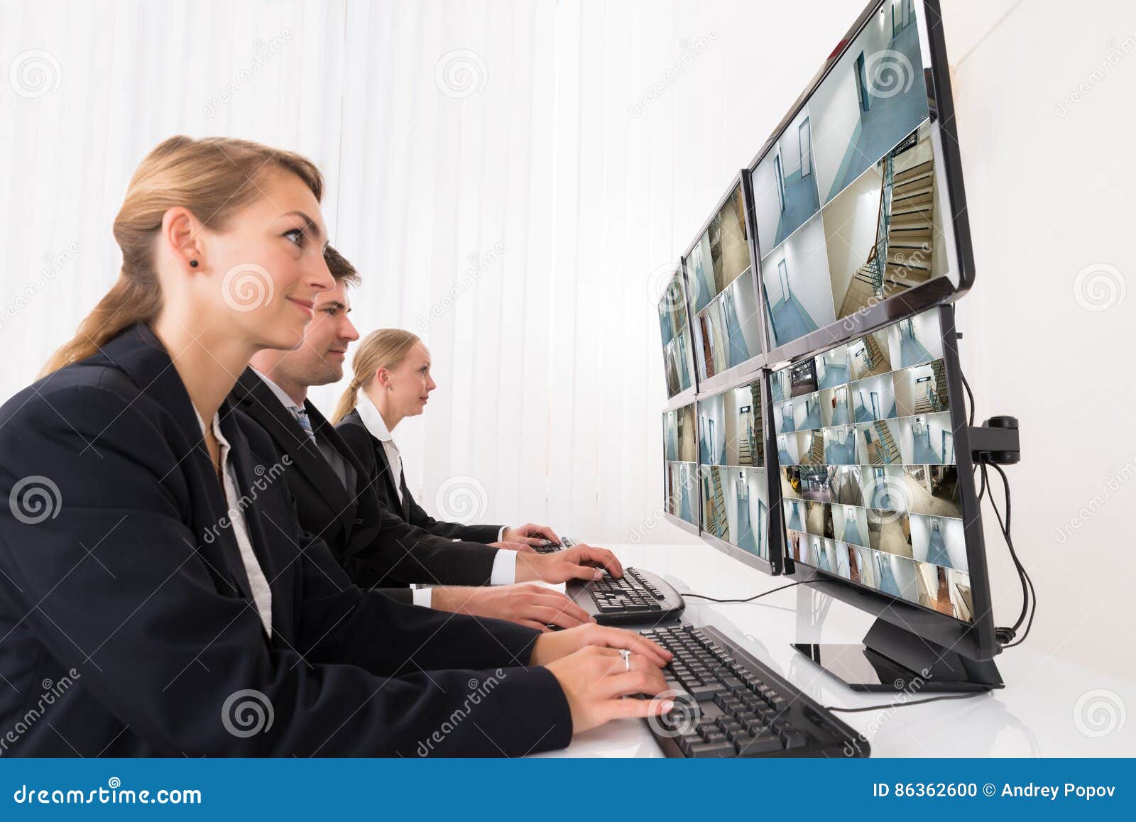 Security System Operators Looking at CCTV Footage Stock Photo - Image ...