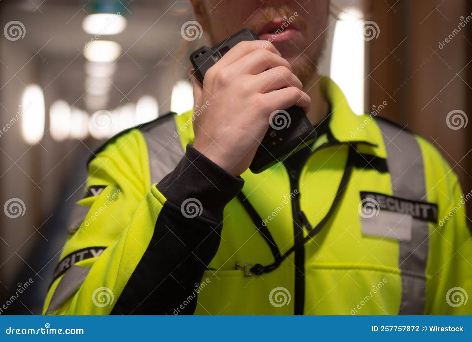 Security Worker Talking on a Walkie-talkie Stock Photo - Image of ...
