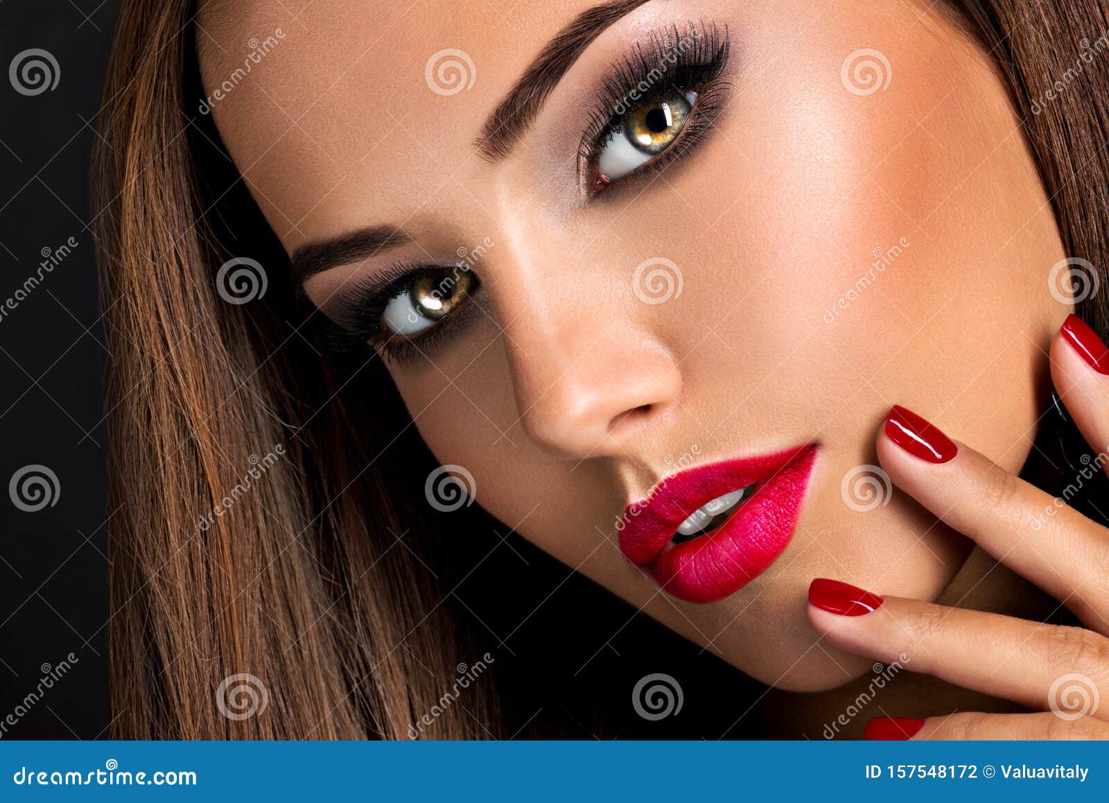Seductive Woman With Dark Brown Eye Makeup And Bright Red Lips And