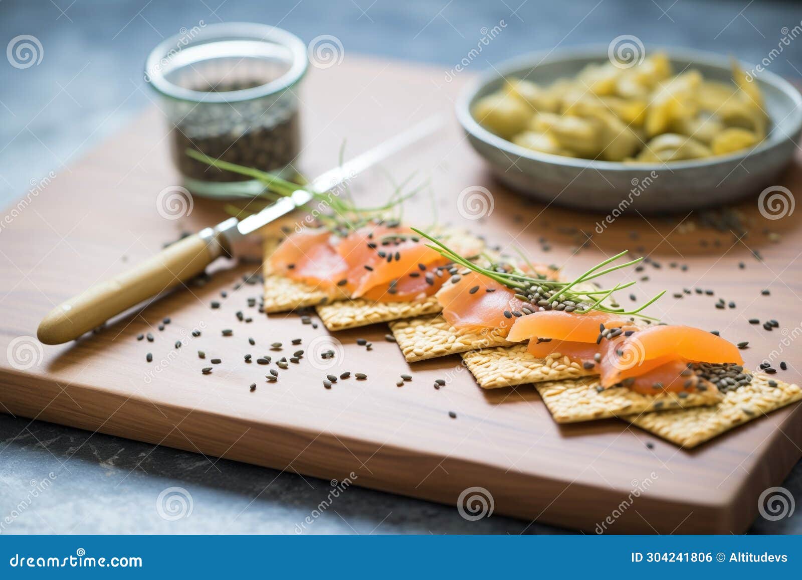 Seed Crackers on a Slate Serving Platter with a Knife Stock Photo ...