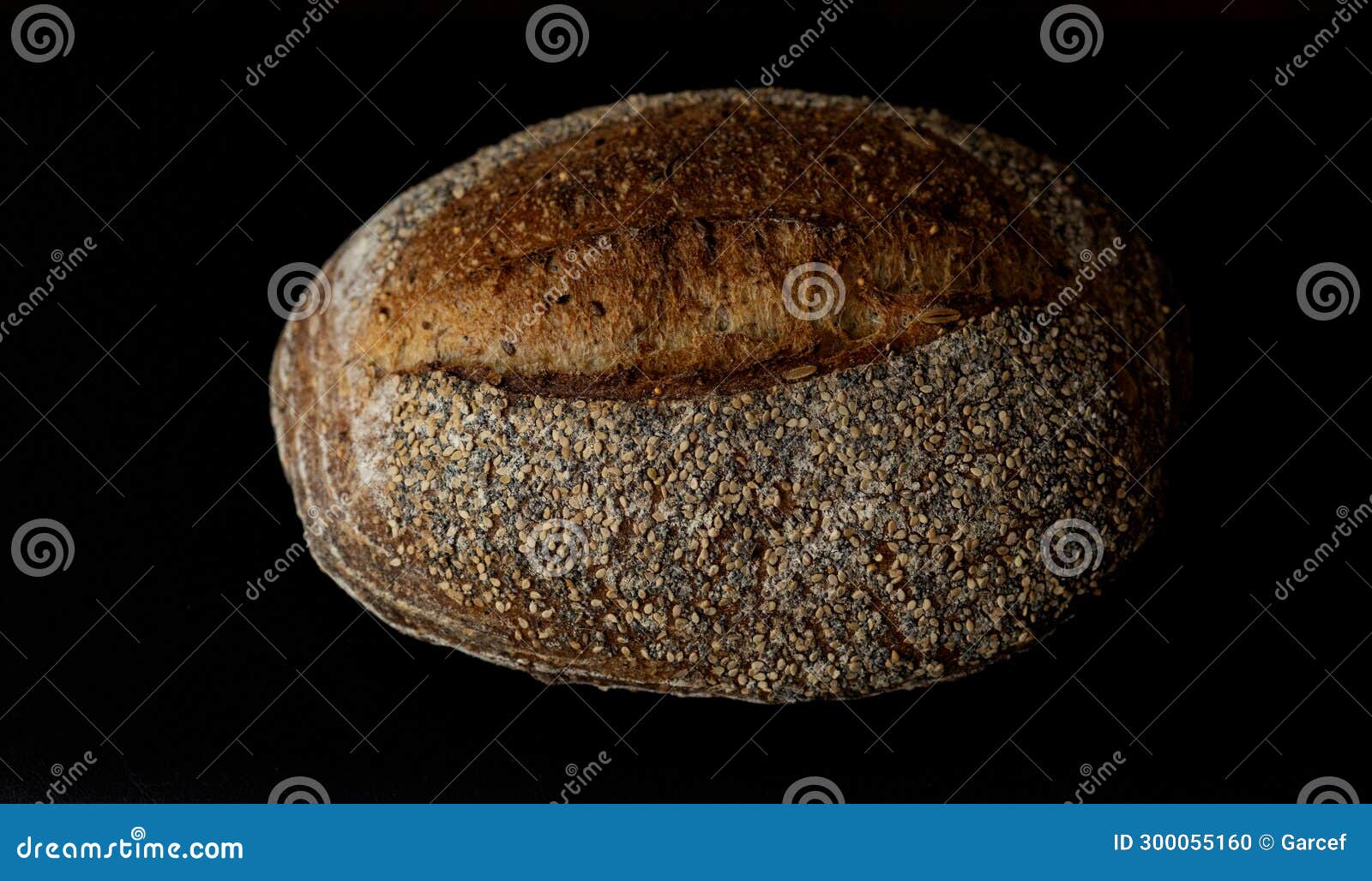 Seeded Loaf of Bread on Black Background Stock Photo - Image of ...