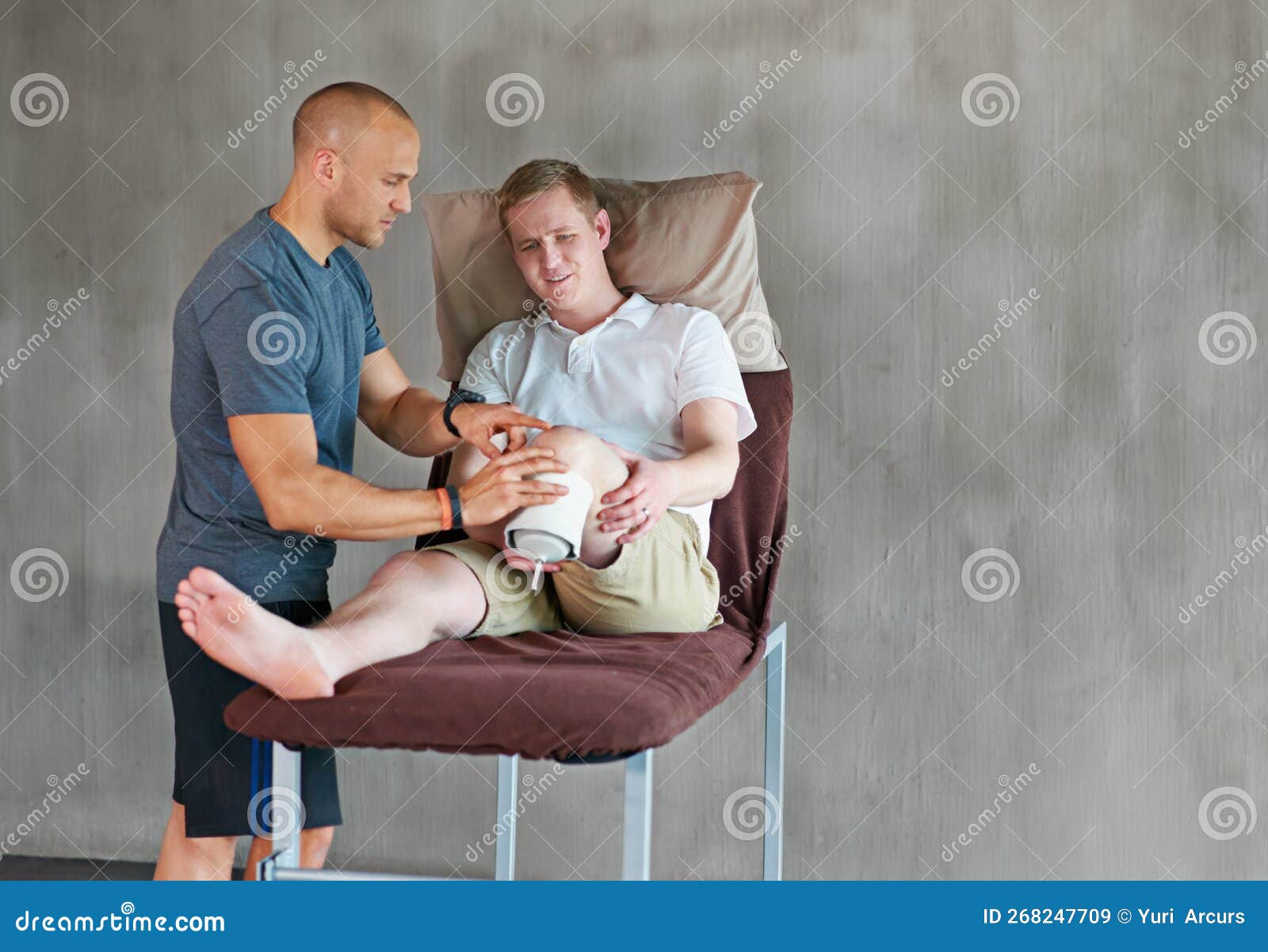 Seeing the Physio. Studio Shot of a Young Amputee Training in a Gym ...