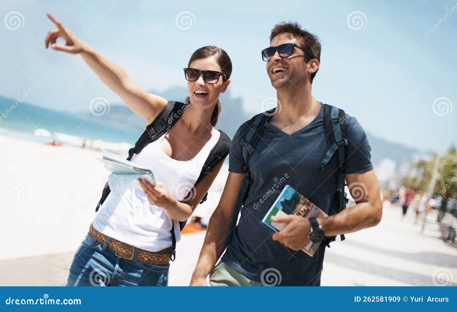 Seeing the Sights in Paradise. Two Young Tourists at the Beach. Stock ...