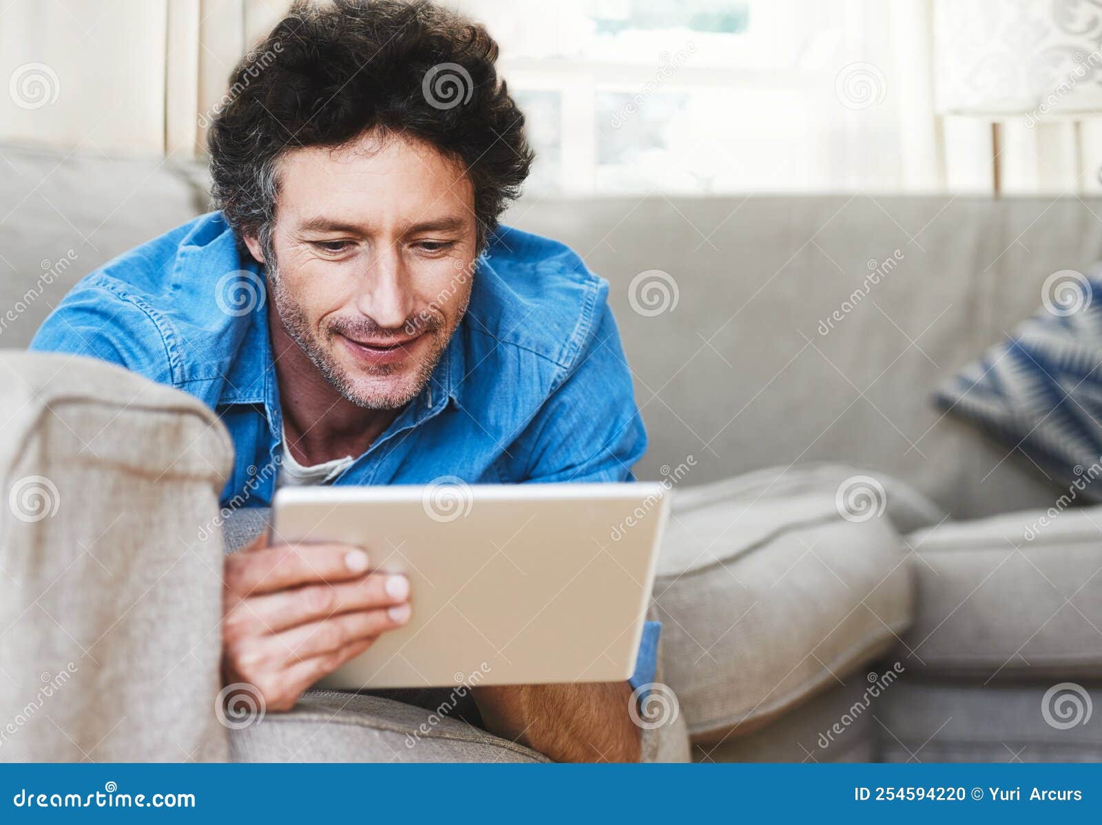 Seeing the World from the Comfort of His Couch. a Bachelor Relaxing on ...