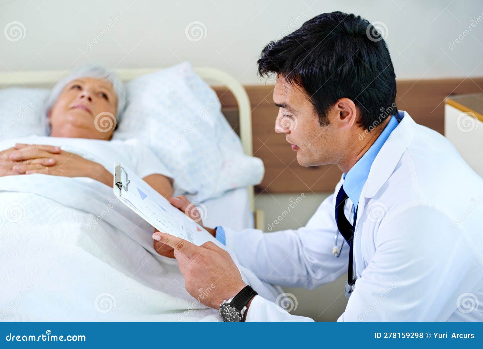 Seeking the Problem. a Handsome Young Doctor Going through a Senior ...