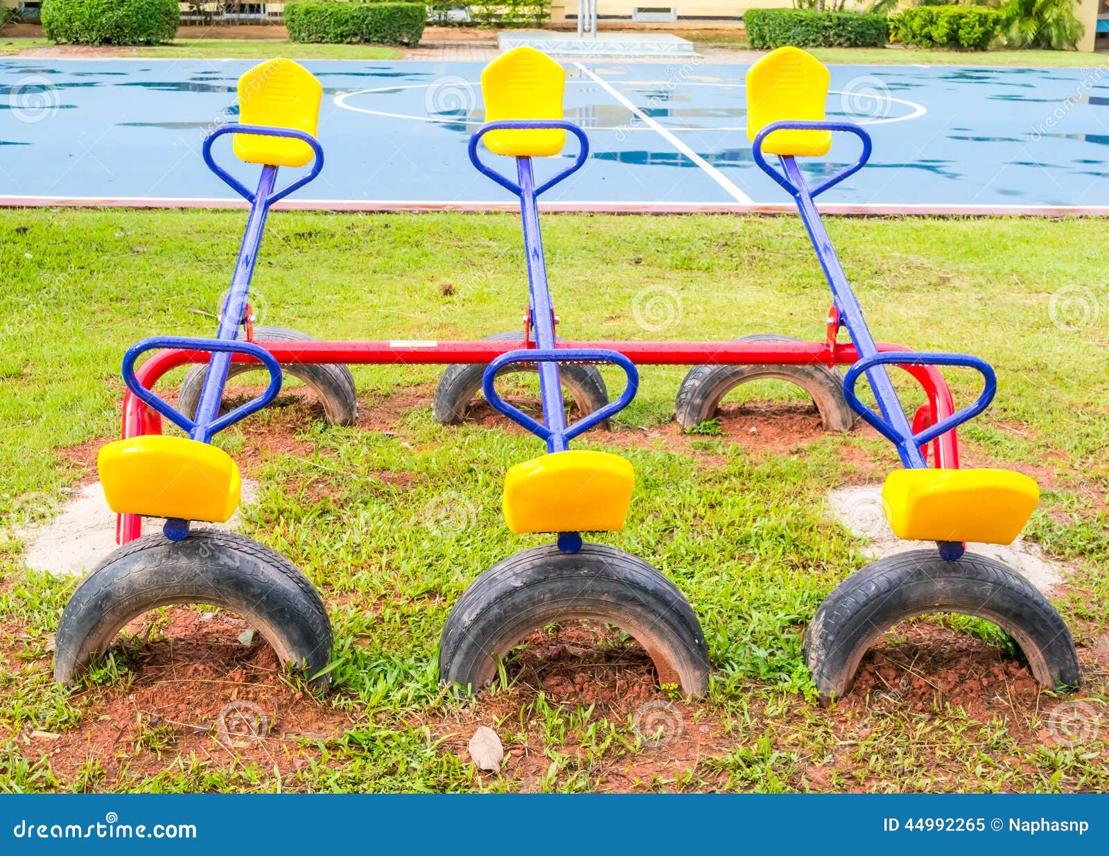 Seesaw Kids playground stock image. Image of bars, green - 44992265