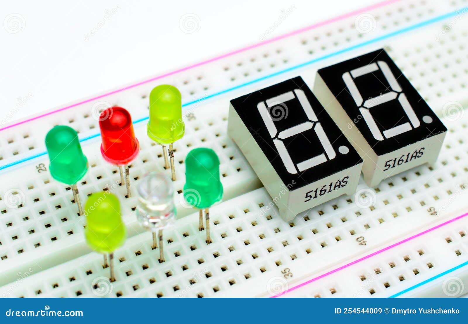7 Segment Arduino Indicators Attached To A Breadboard With A Colorful