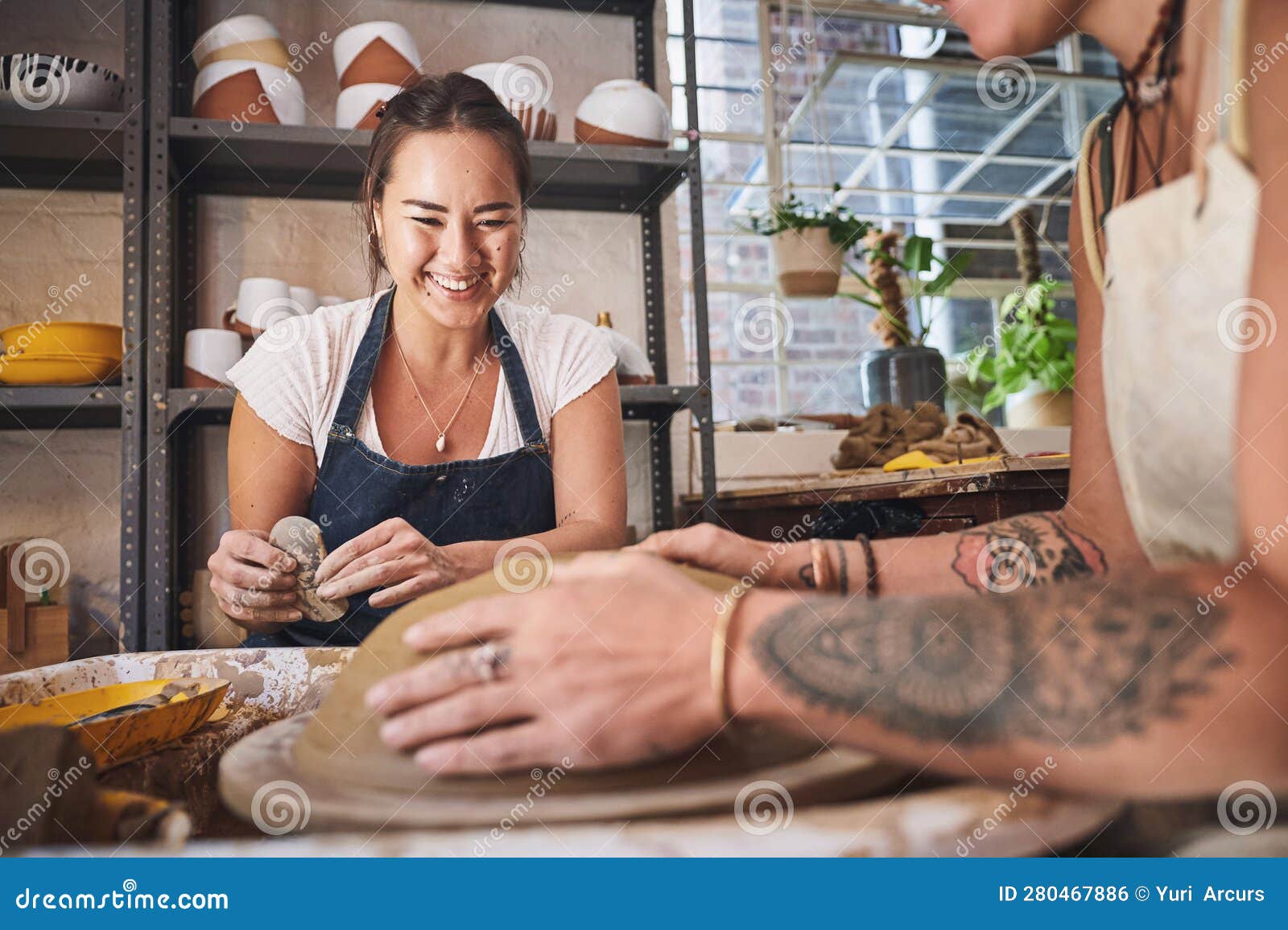 Seize the Clay with Both Hands. Two Young Women Working with Clay in a ...