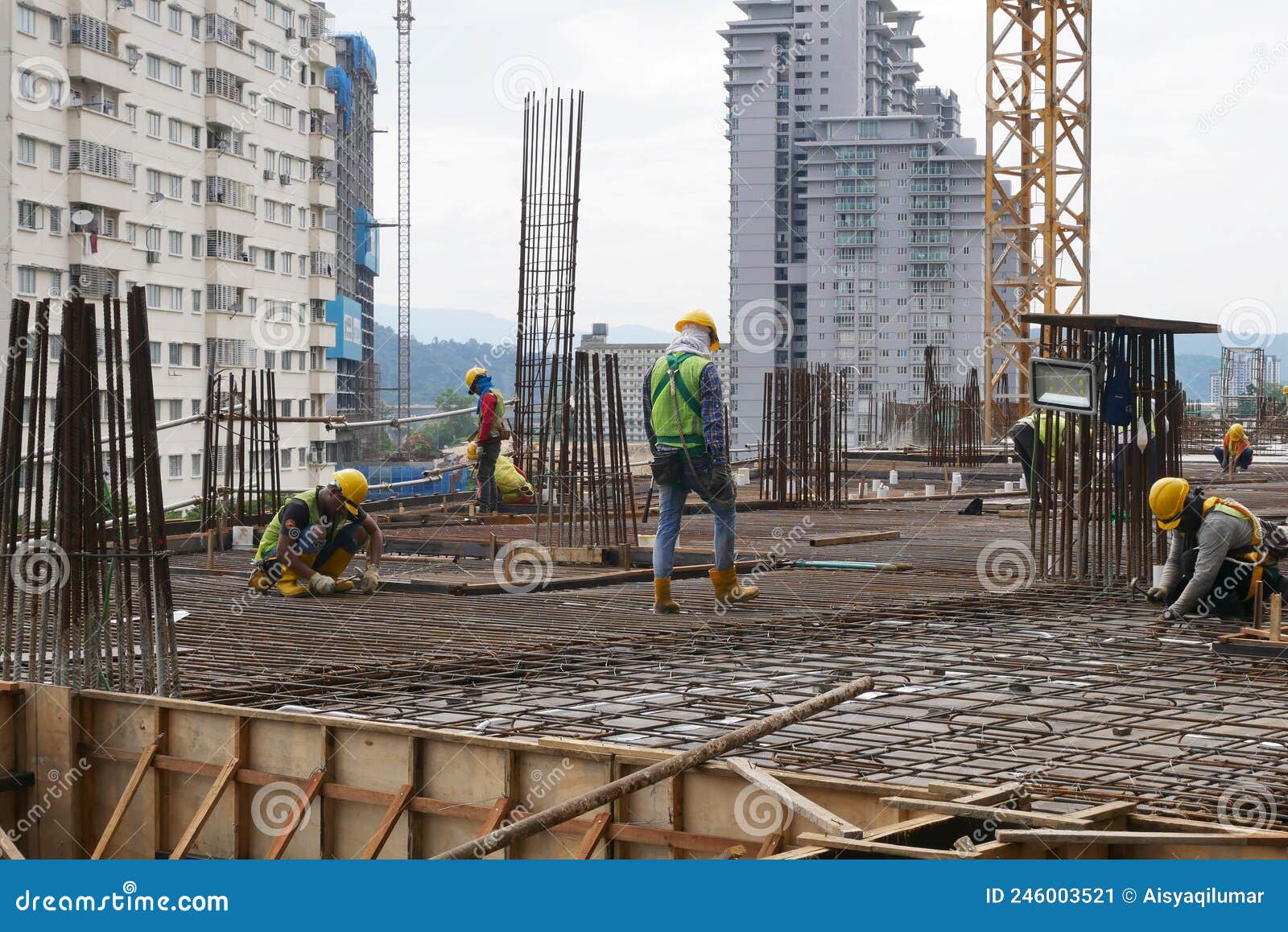 A Group of Construction Workers is Working at a Construction Site ...