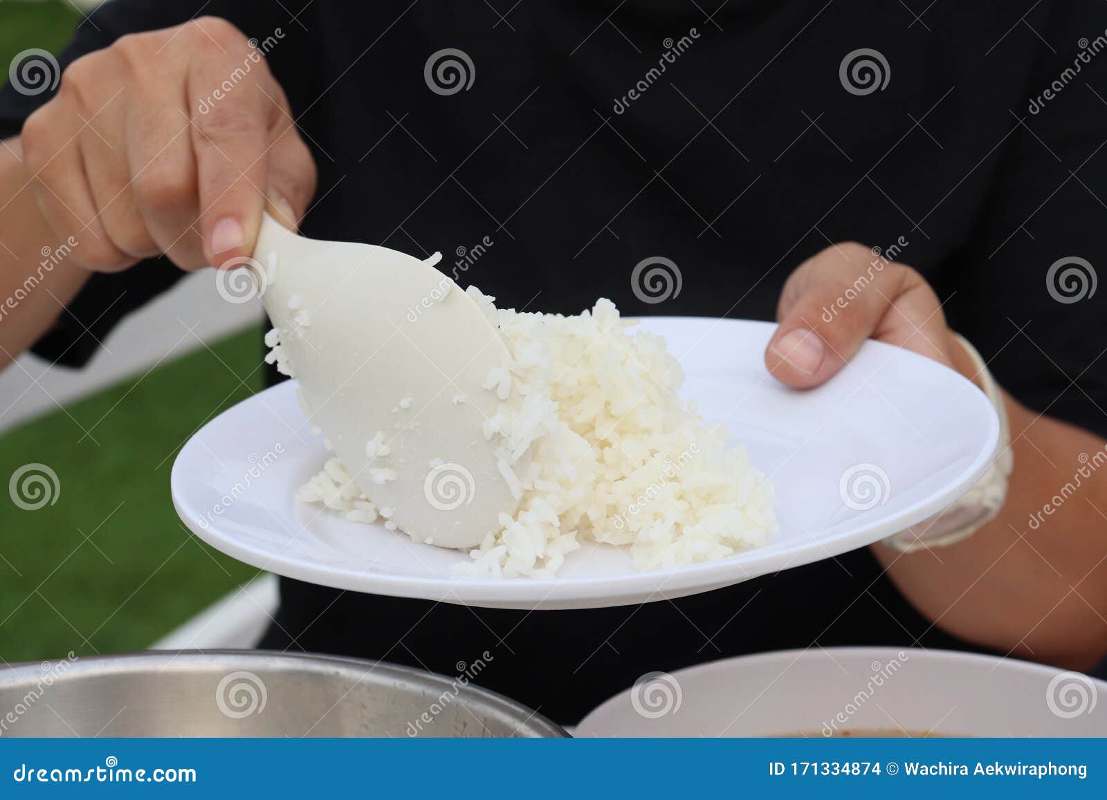 Select Focus Cooked Rice in White Plate, Ladle in Hand Held Scoop from ...