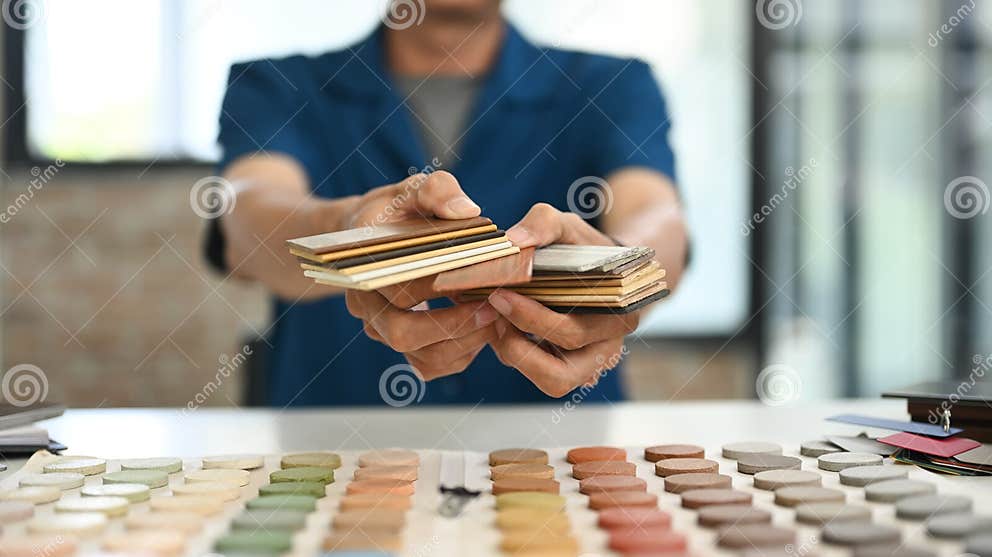 Select Focus Hands of Interior Designer Holding Material Samples ...