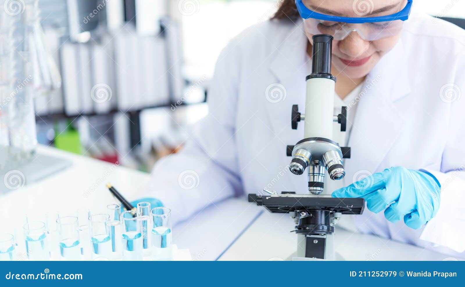 Scientists Analyzing Study Data And Evaluating Microscope. Health Care ...