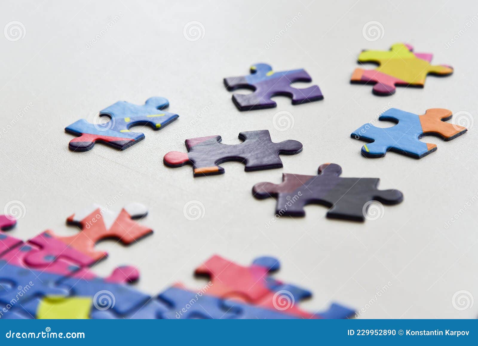 Selected Focus on Fragment of a Folded Jigsaw Puzzle and a Pile of ...
