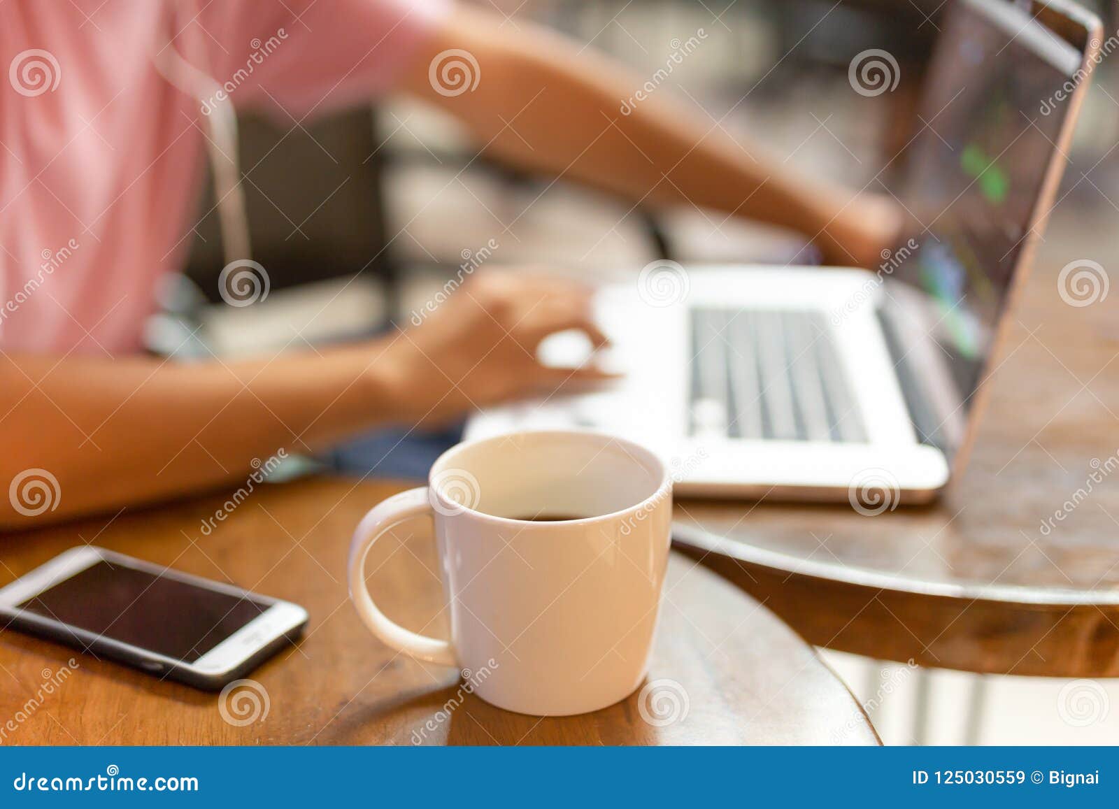 Selected Focus Mug of Coffee on the Table with People Working on Stock ...