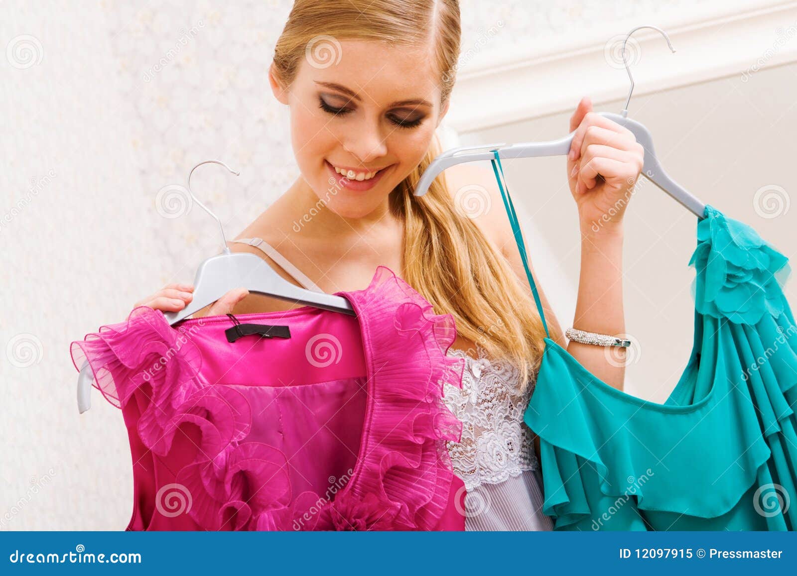 Selecting clothes stock image. Image of blonde, charming - 12097915
